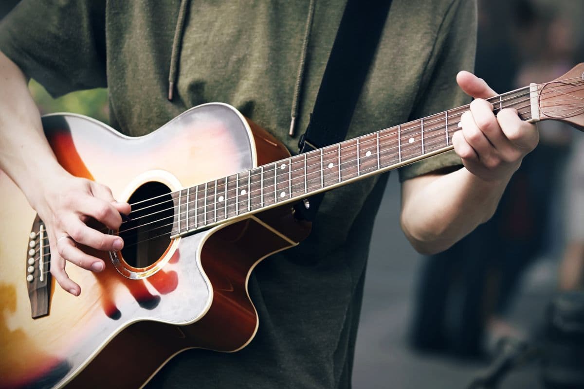 The Complete Guide to Holding a Guitar While Standing