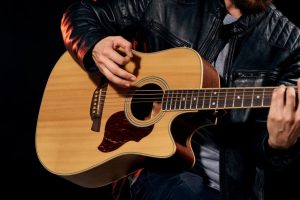 The Complete Guide to Holding a Guitar While Standing